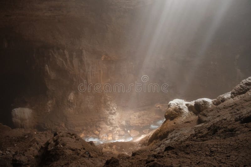 Ethereal Light Rays Gracefully Touch the Stone Floor of Cave Jomblang ...