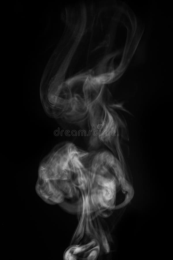 Ethereal Smoke Patterns Swirling Gracefully in the Air Creating a Mesmerizing Visual Display of ...