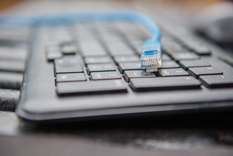 Ethernet Cable Plug Connector on Computer Laptop Keyboard Technology ...