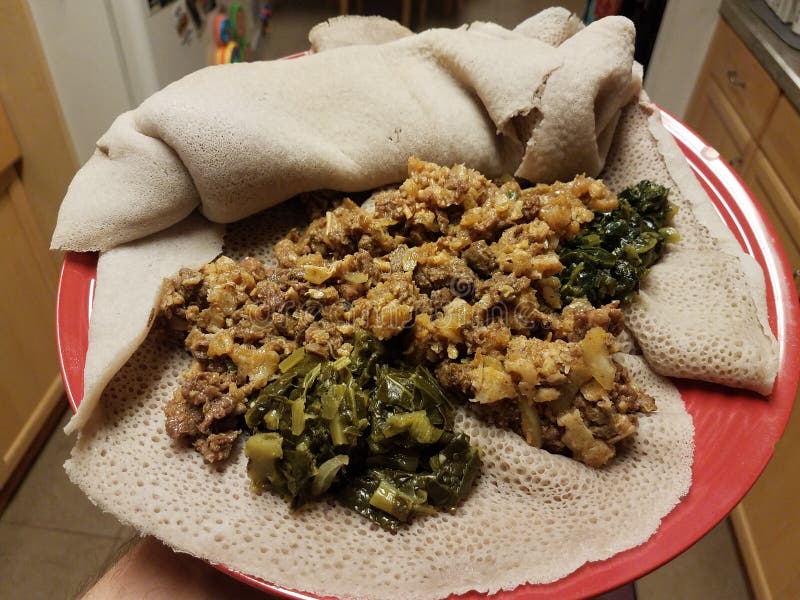 Ethiopian Food Beef and Tripe with Greens and Bread Stock Photo - Image ...