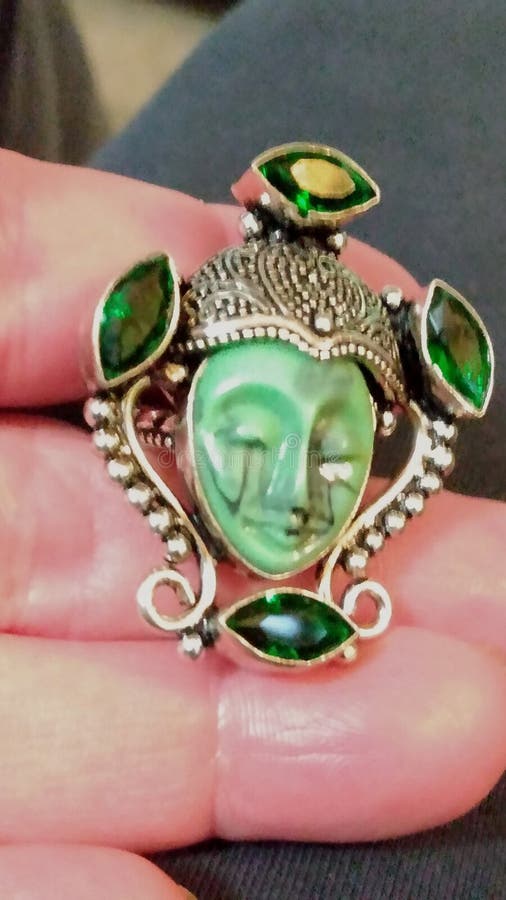 Ethnic FACE Ring with Shimmering Emeralds Stock Image - Image of ring ...