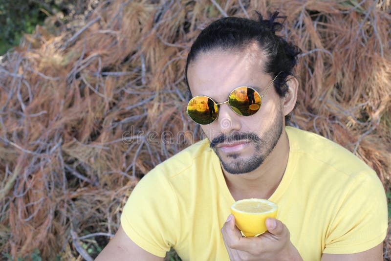 Ethnic Man in Yellow Holding Bright Lemons Stock Image - Image of fresh ...