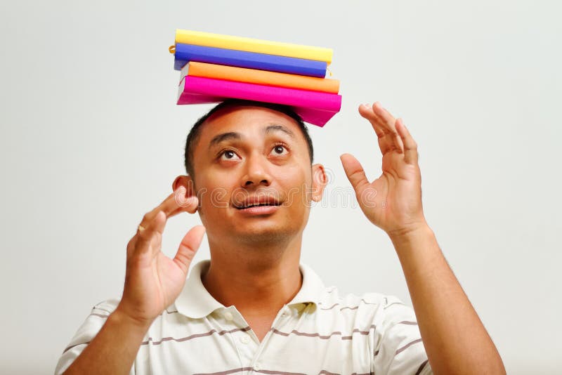 Ethnic Young Man Balance Books Head Stock Photos - Free & Royalty-Free ...
