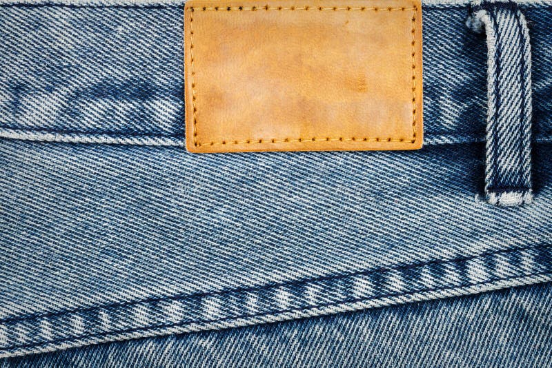 Etiqueta cosida en tejanos imagen de archivo. Imagen de blanco - 60665401