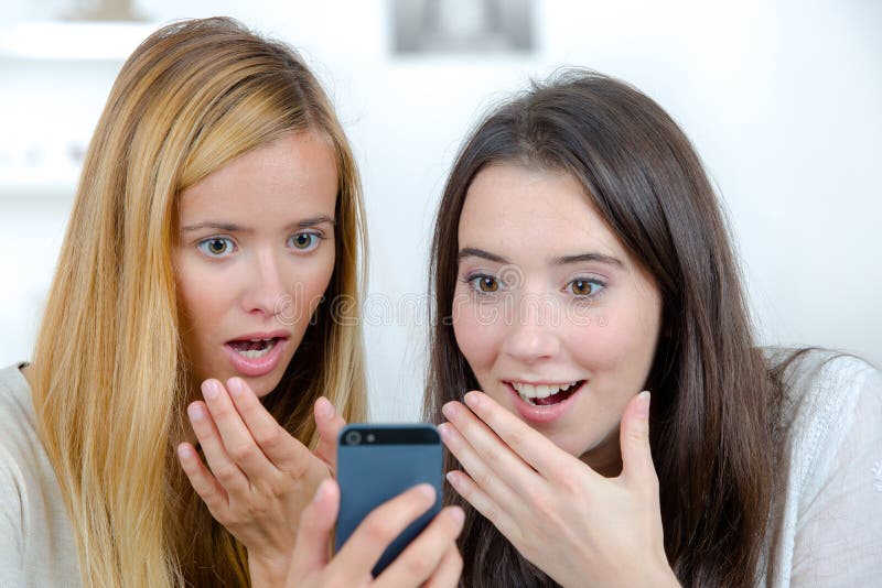 Euphoric Friends Watching Videos on Smartphone Stock Image - Image of ...