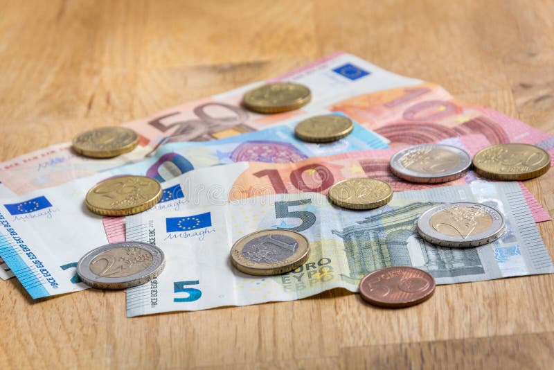 Euro Bank Notes and Coins Close Up on Wooden Table Stock Image - Image ...