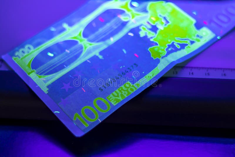 100 Euro Banknote. Lying in the Ultraviolet To Verify the Authenticity ...