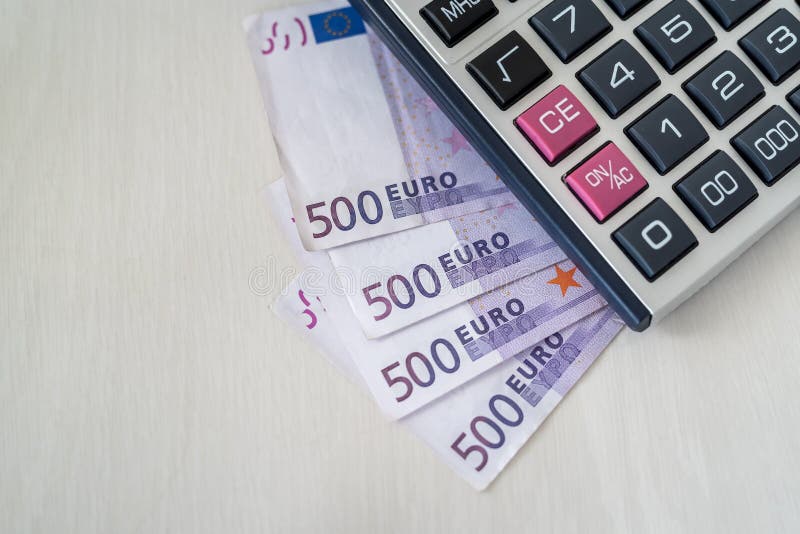Euro Banknotes with Calculator on Wooden Desk Stock Image - Image of ...