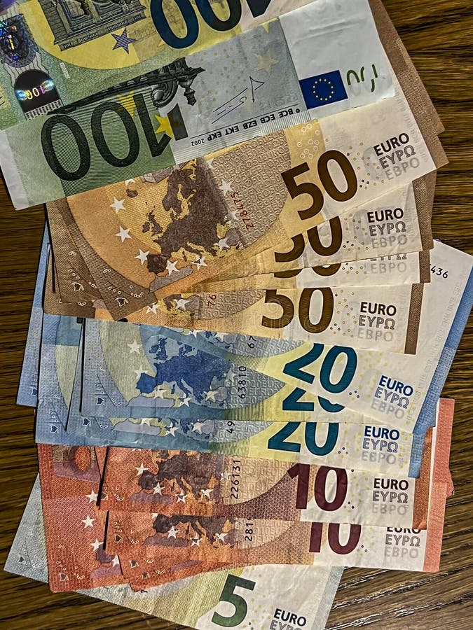 Euro Banknotes of Different Denominations Lying Disorderly on the Table ...