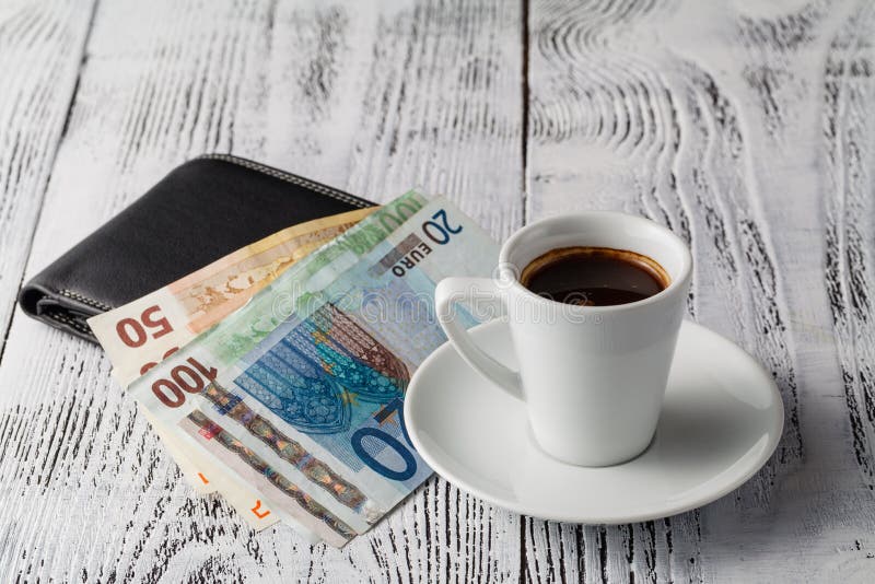 Euro Bill and Cup of Coffee on Wooden Table. Payment, Tip Stock Photo ...