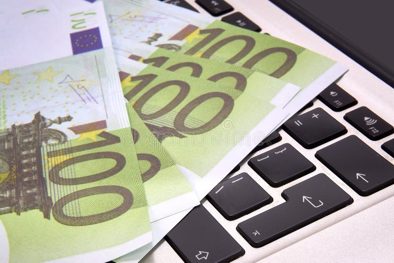 100 Euro Bills Lying on a Computer Keyboard, Close-up Stock Image ...