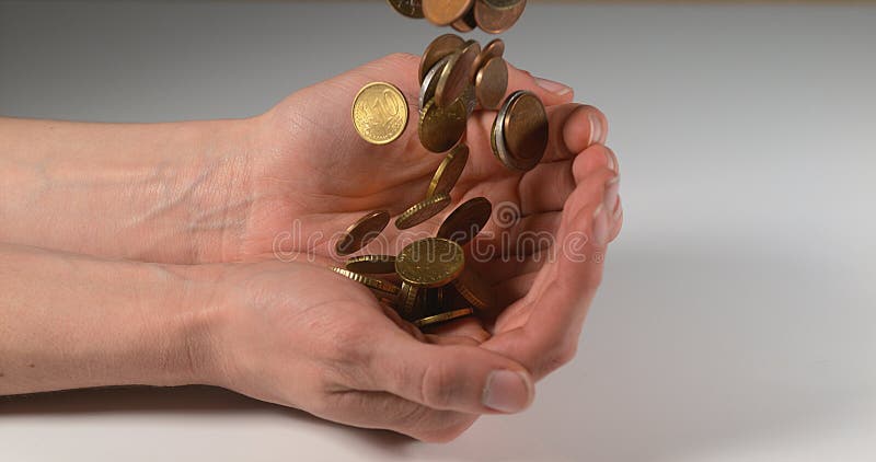 Euro Coins Falling into Hands of Woman Against White Background Stock ...