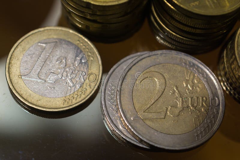 Euro Coins and Many Coins Stacked Stock Photo - Image of metal ...