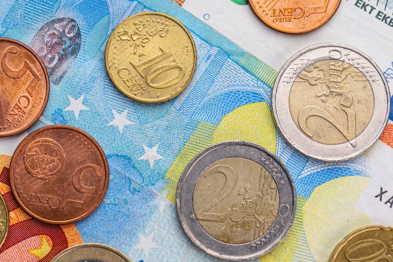Euro coins on Euro notes.. stock image. Image of currency - 272436825