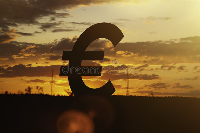Euro Money Sign at Sunset in the Rays of the Setting Sun. Sunset ...