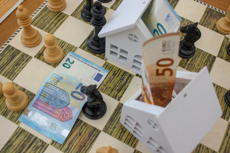 Euro Notes and Tiny Houses on the Chessboard Stock Photo - Image of ...