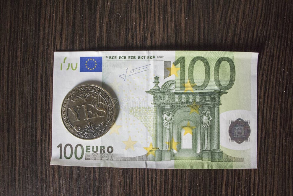 Euro on the Table with a Coin `Yes` Stock Photo - Image of technology ...
