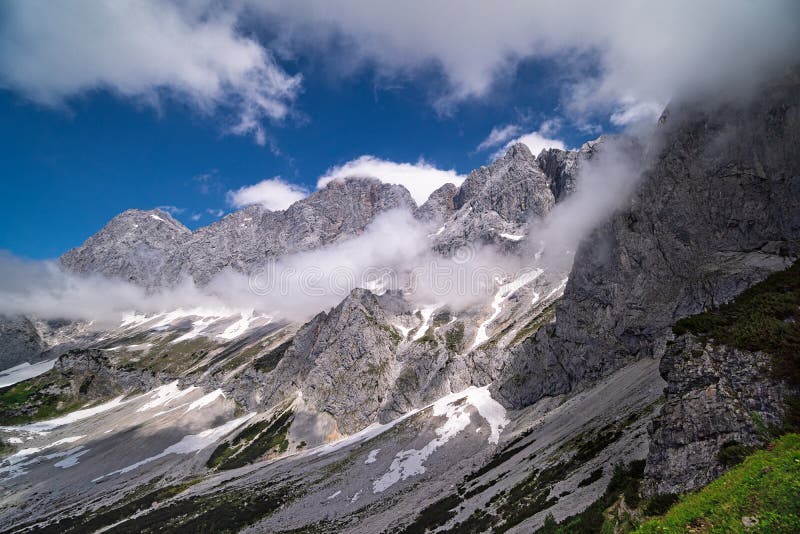 European Alps with clouds stock image. Image of tranquil - 224186433