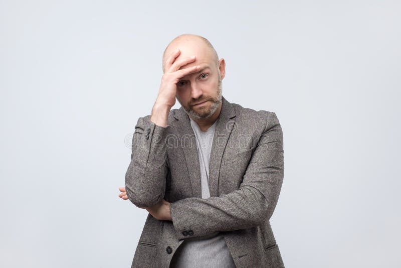 European Bald Man Depressed with Hand on His Head Stock Photo - Image ...