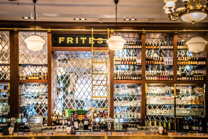 European Bistro Interior with Table Settings and Chandeliers Stained ...