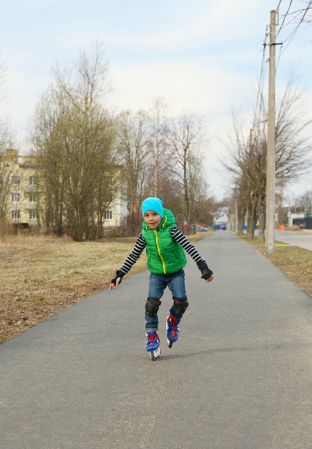 European Boy Riding on Roller Skates Stock Photo - Image of early ...