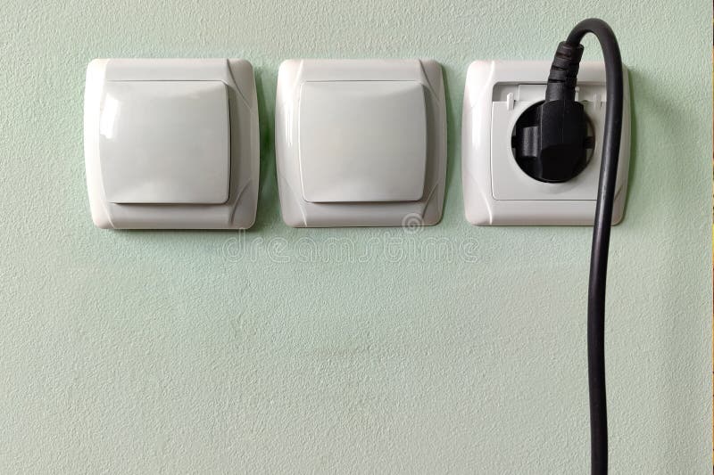 European Electrical Outlets with Plug Inserted into it on Modern Beige ...