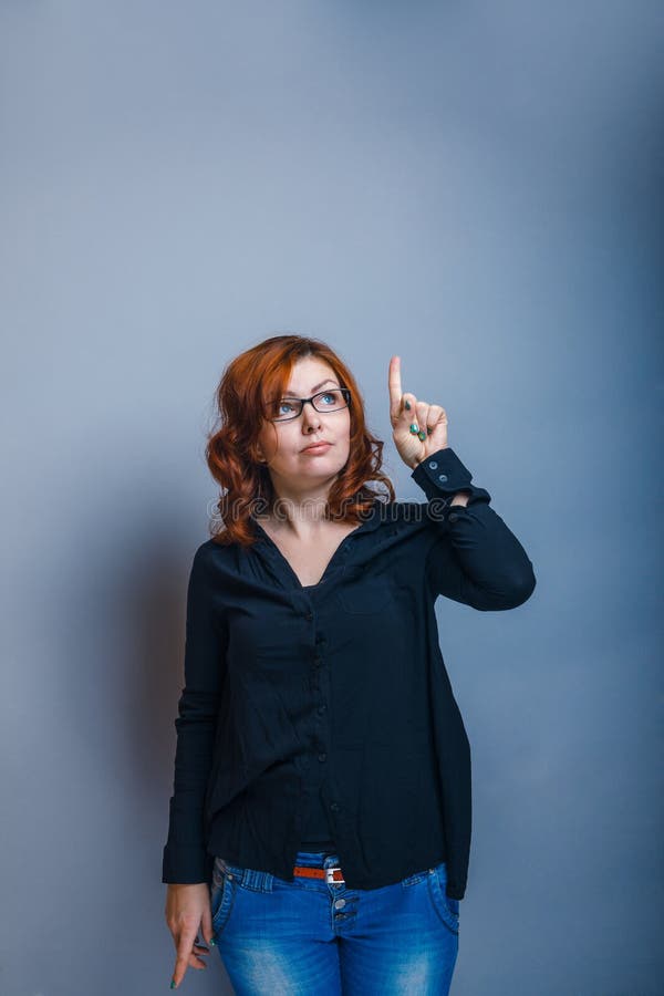 European-looking Woman of 30 Years is Pointing in Stock Image - Image ...