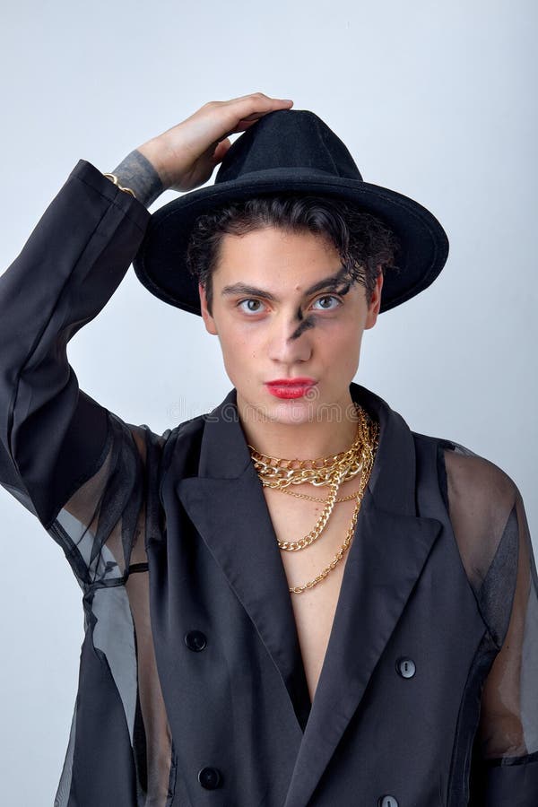 European Man Looking As Woman In Black Shirt And Hat Posing At Camera