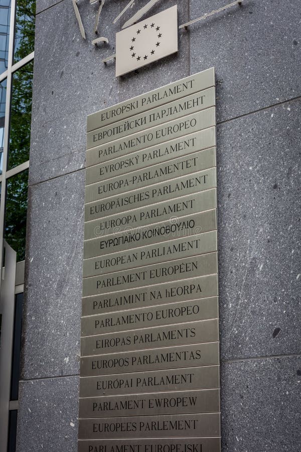 Multilingual Sign and EU Flag on European Parliament Building in ...