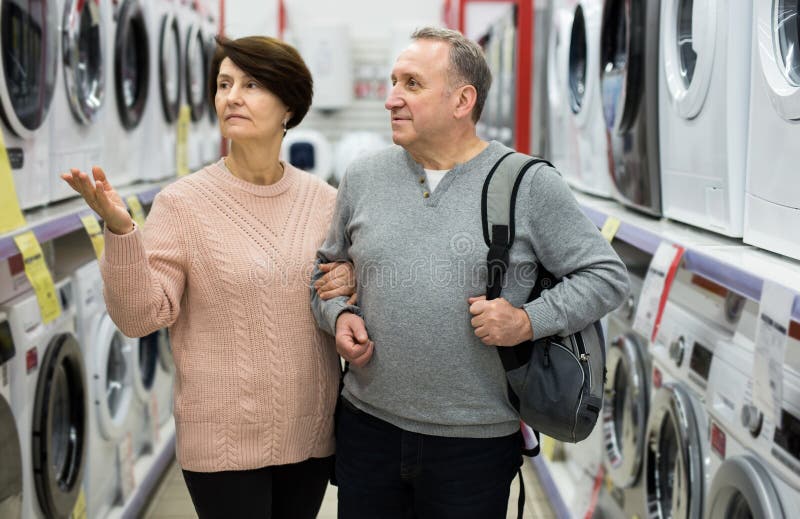 European Spouses of Mature Age Choose a Washing Machine Stock Image ... European Spouses of Mature Age Choose a Washing Machine Stock Image ...
