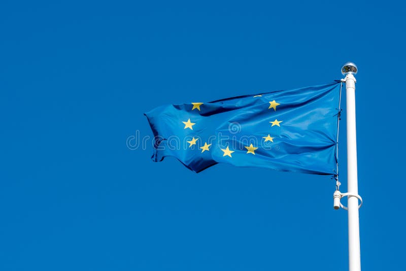 European Union Flag Flying in Front of Blue Sky Stock Photo - Image of ...