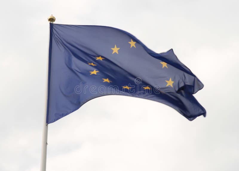 European Union Flag Flying in Front of Bright Blue Sky Stock Photo ...