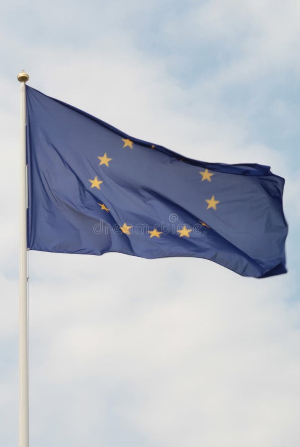 European Union Flag Flying in Front of Bright Blue Sky Stock Photo ...