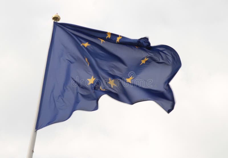 European Union Flag Flying in Front of Bright Blue Sky Stock Photo ...