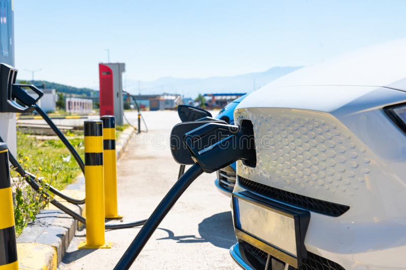EV Car Charging Outside. Close Up View of a Charging Electric Car Stock ...