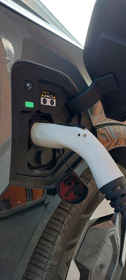 Ev Charger Handle Plugged in Ev Car Recharging Battery Stock Photo ...