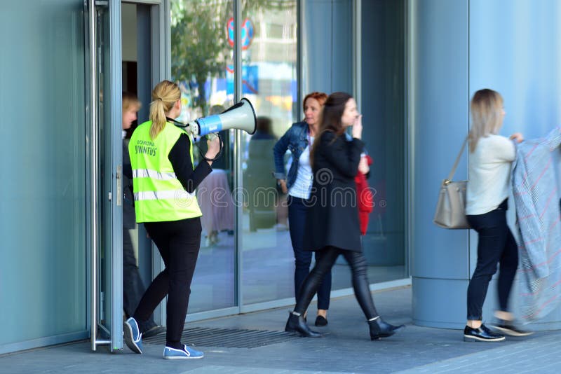Evacuation of an Office Building. People Exit the Building on Exit Door ...