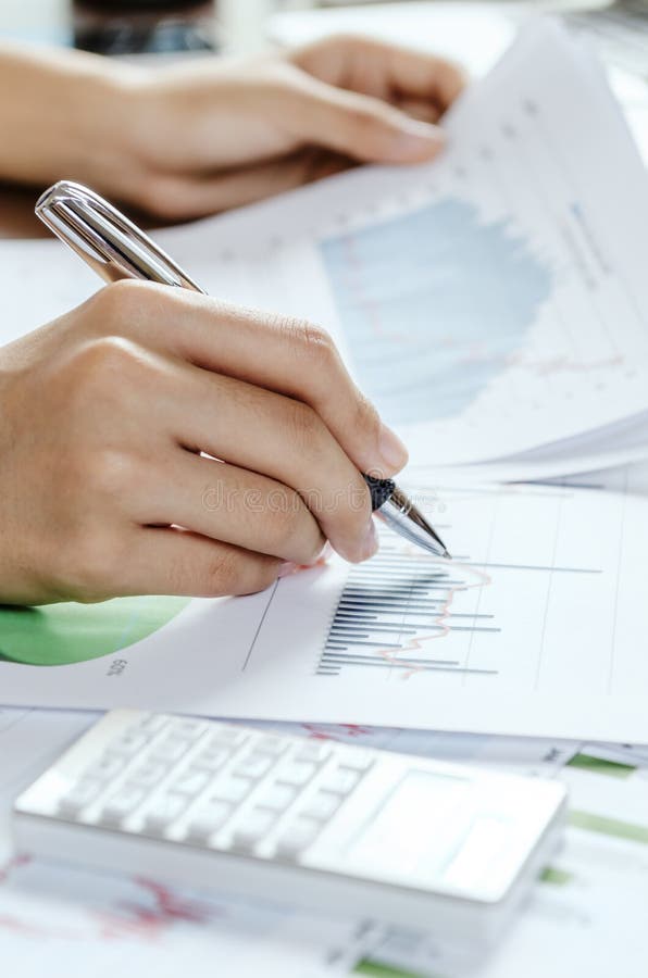 Evaluating data stock image. Image of pointing, graph - 51367373