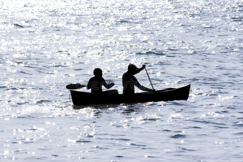 Evening canoe ride stock image. Image of sillouette, canoe - 6128465