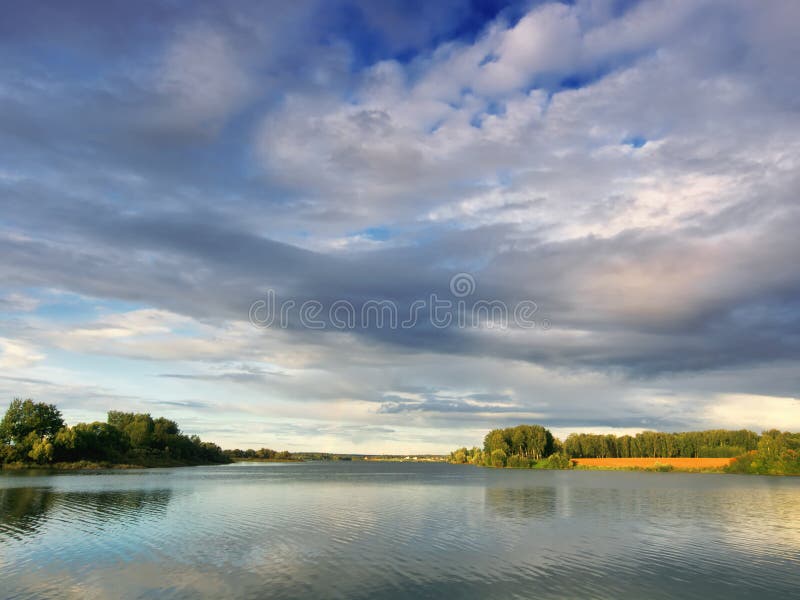 Evening clouds above lake stock image. Image of pond - 21243453