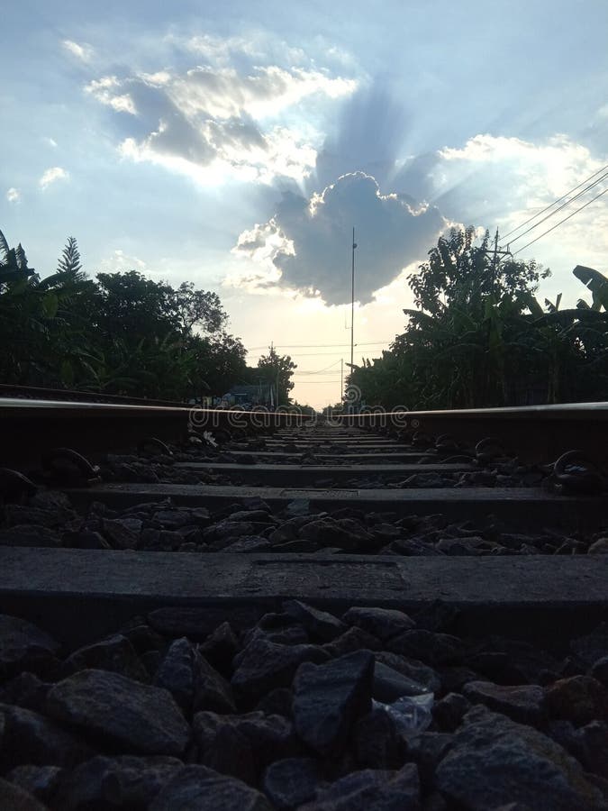 Evening Clouds in the Middle of the Train Tracks Stock Image - Image of ...