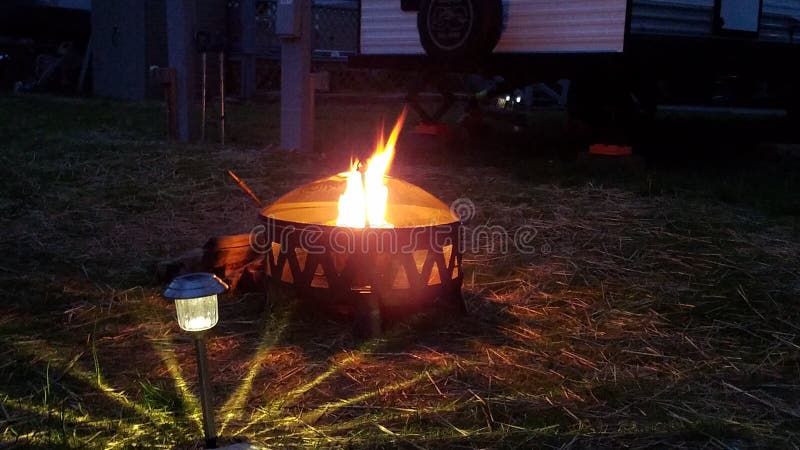 Enjoying an Evening Campfire Stock Image - Image of firepit, cozy ...