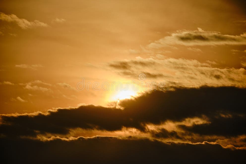 Evening Dramatic Sky with Clouds during Sunset. the Sun Sets Behind Dark Clouds Stock Photo ...