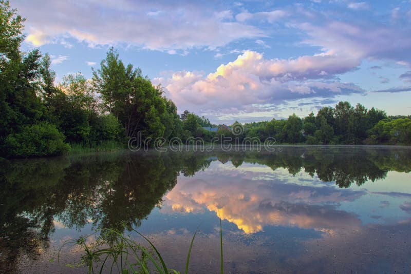Evening on the lake stock image. Image of blue, foliage - 32047737