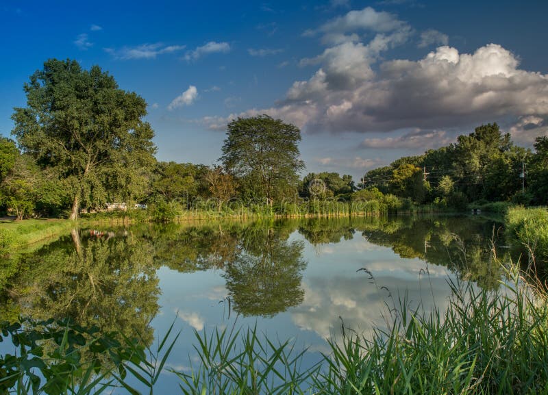 Evening Pond Reflection stock image. Image of season - 57888959