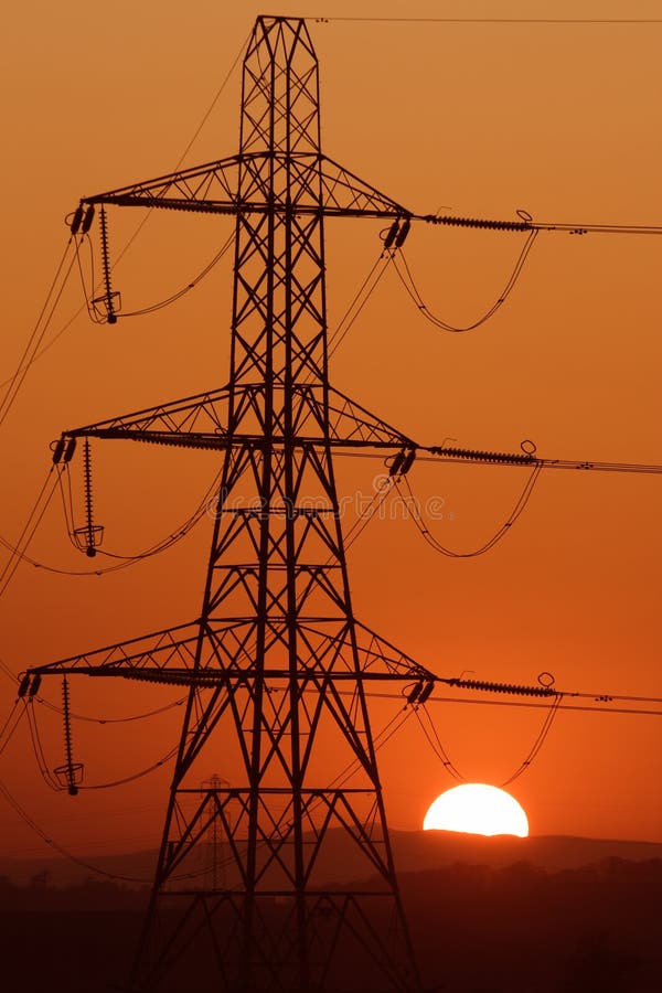 Electricity pylons stock photo. Image of silhouetted - 14338492