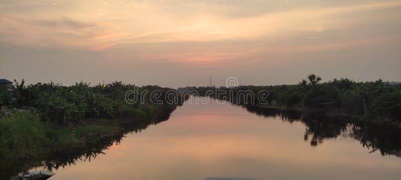 Evening river reflection stock image. Image of shore - 221483839