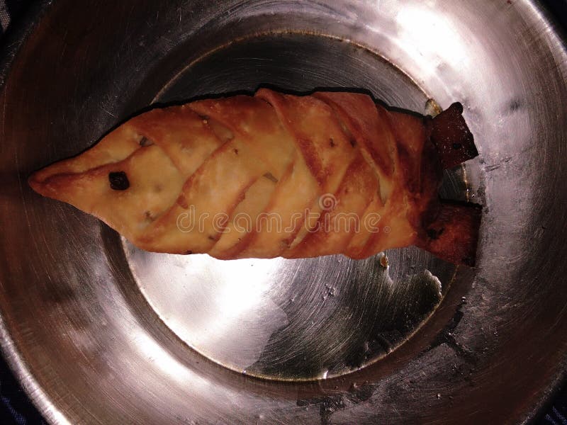 An Evening Salty Snack of Fish Shape with Coconut Fillings Inside Stock ...