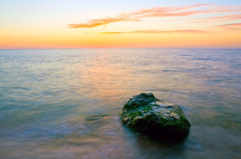 Evening scene on sea stock image. Image of rock, sand - 18238015