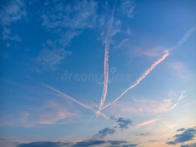 Evening Sky with Three Crossed Traces of Planes and Growing Moon Stock ...